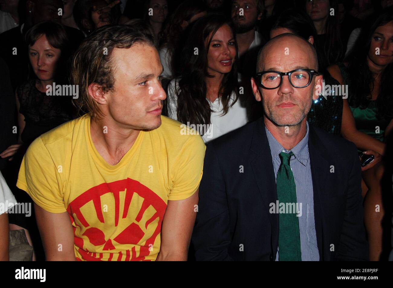 Actor Heath Ledger (L) and musician Michael Stipe sit front row at the ...