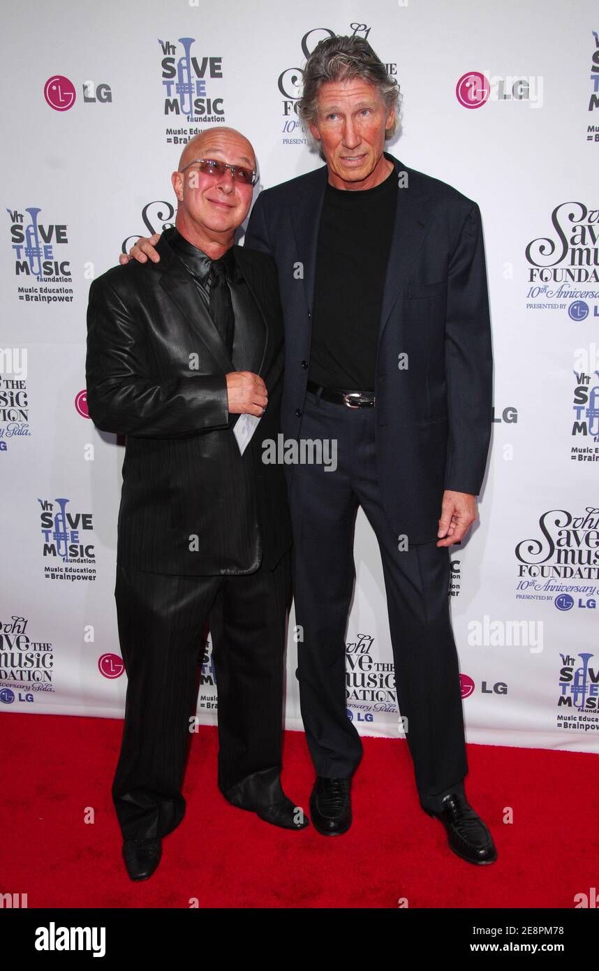 Musicians Paul Schafer and Roger Waters arrive at the VH1 Save The ...