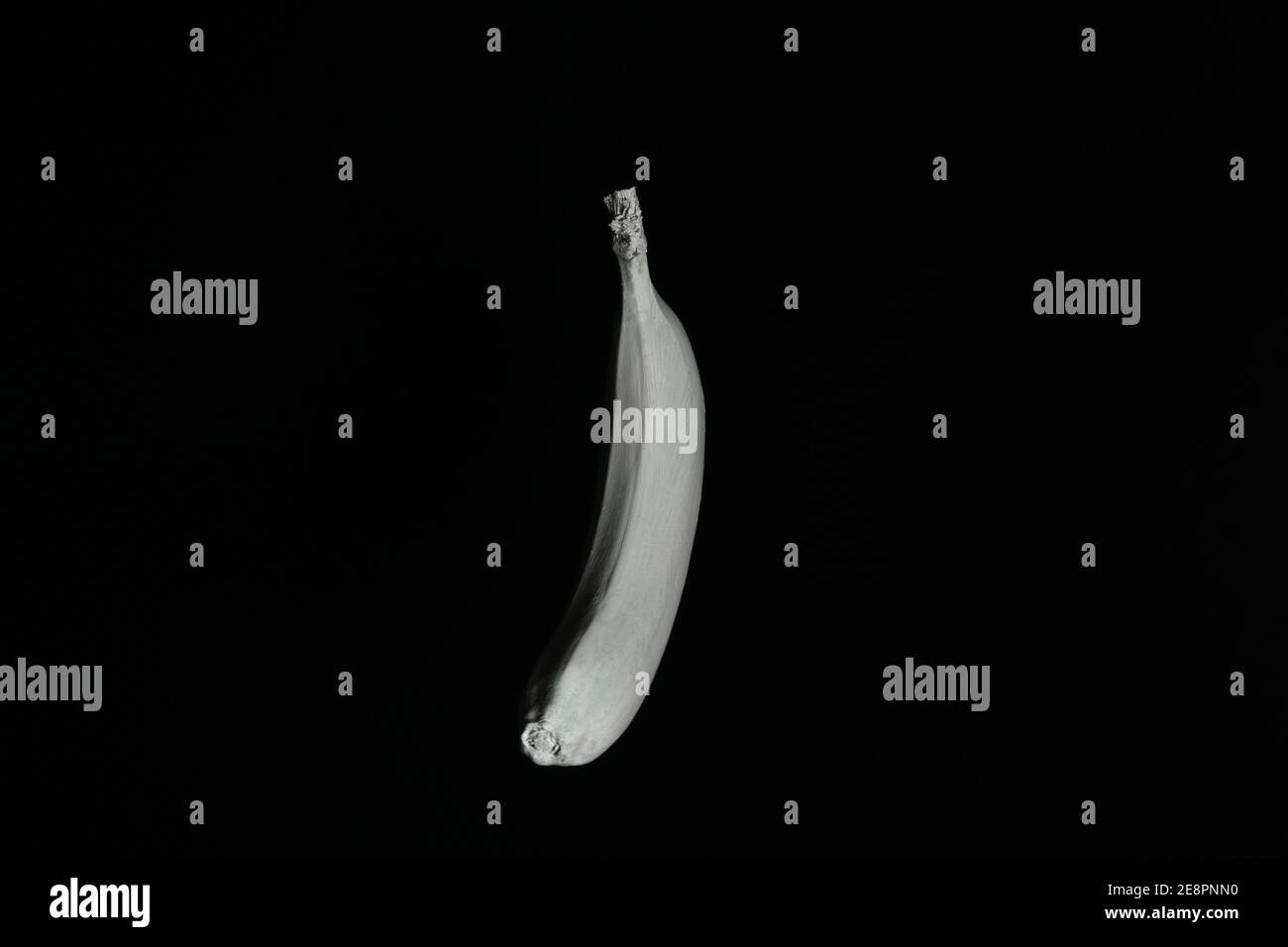 White floating banana on a black background. Front side. Creative fruit ...