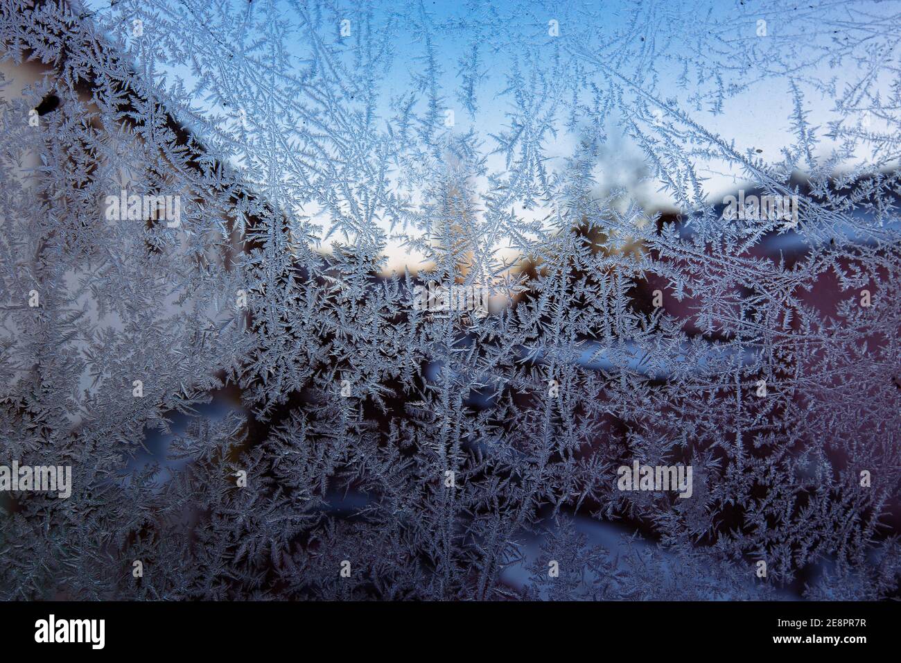 Frozen glass. Frost patterns on window pane Stock Photo - Alamy