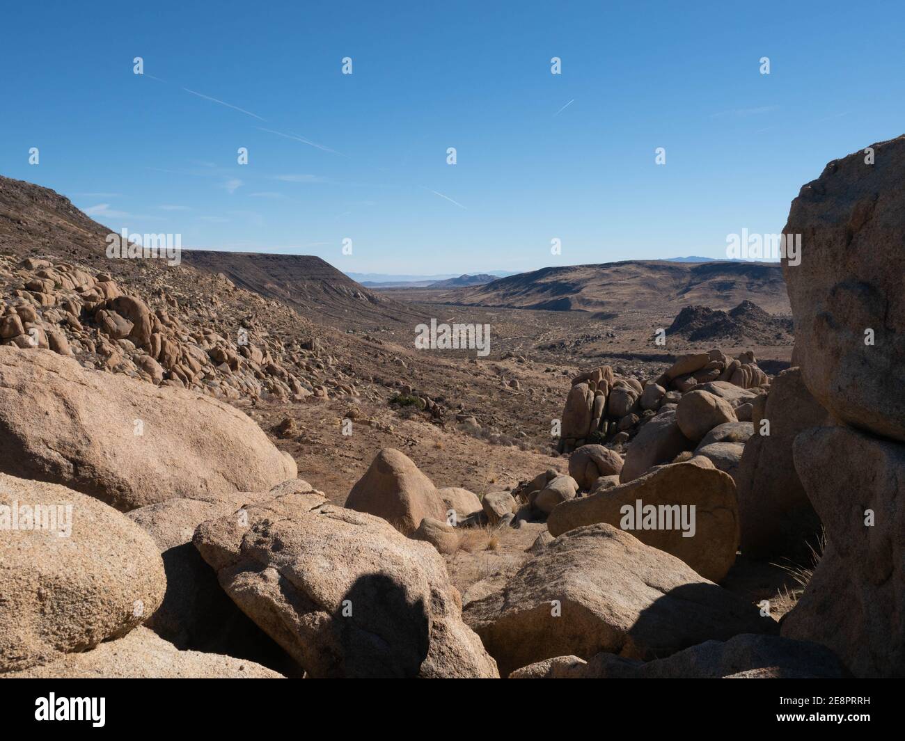 Colorful panorama of boulders, desert scenery, mountains at sunset in ...