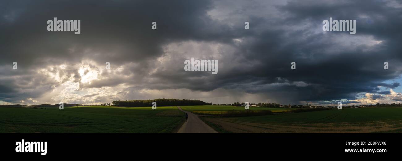 Panorama of rural landscape at wild changing stormy weather condition ...