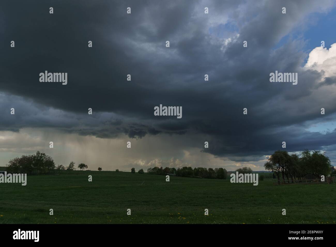 rural landscape with april weather condition with rain and sun over ...