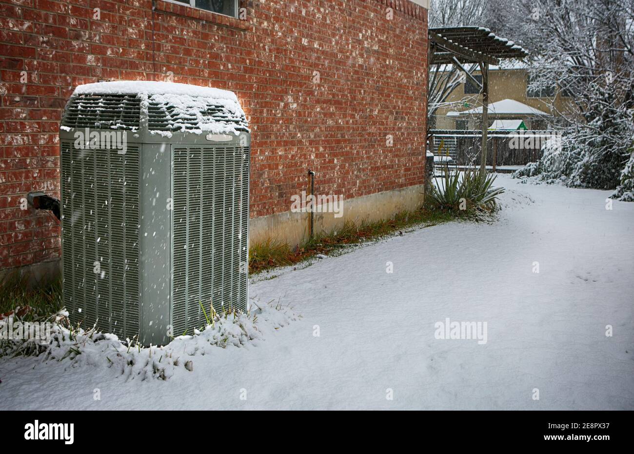 Modern high efficiency air conditioner under falling snow Stock Photo ...