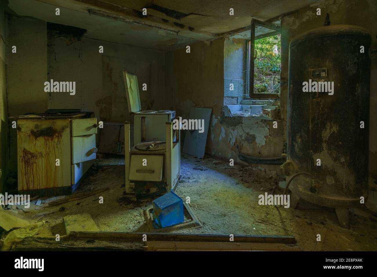 abandoned kitchen inside destroyed house with old rusty steel water ...
