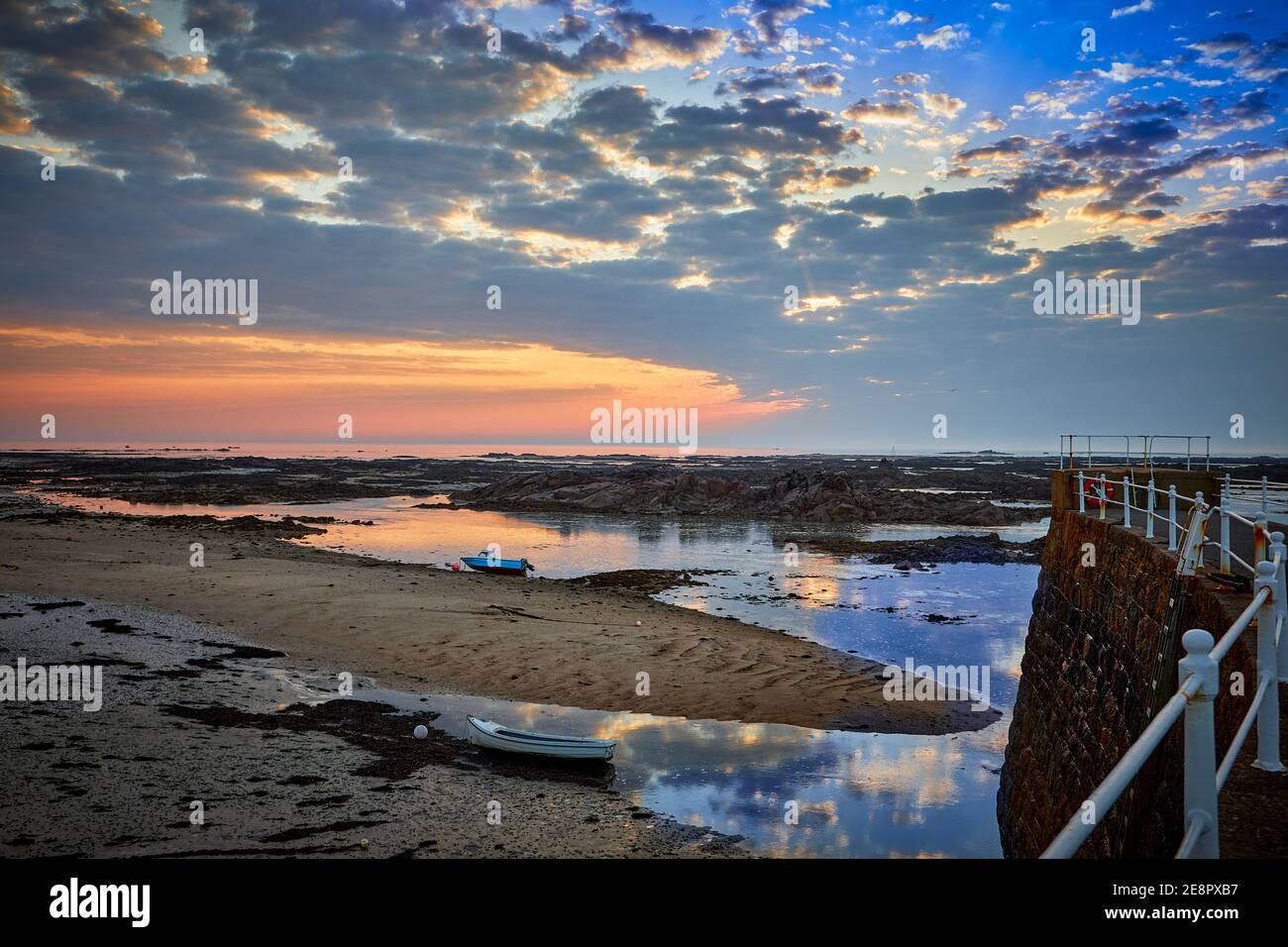 Image of La Rocque Harbour at sunrise with clouds and calm sea. Jersey ...