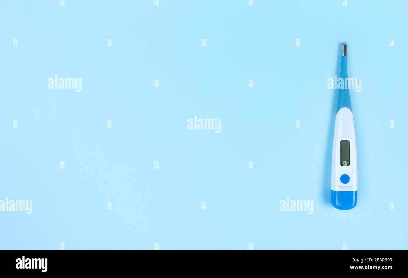 Electronic thermometer on a blue background with copy space Stock Photo ...