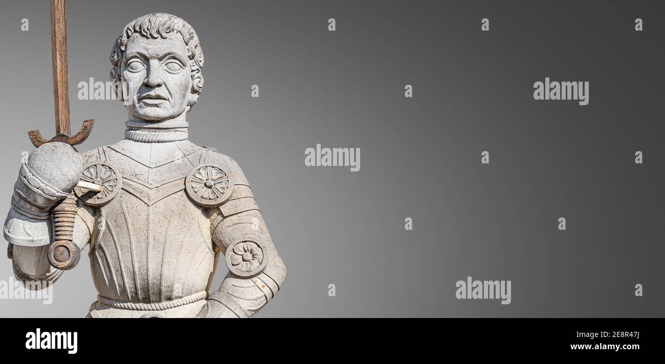 Banner with an ancient sculpture of a German knight with a sword ...