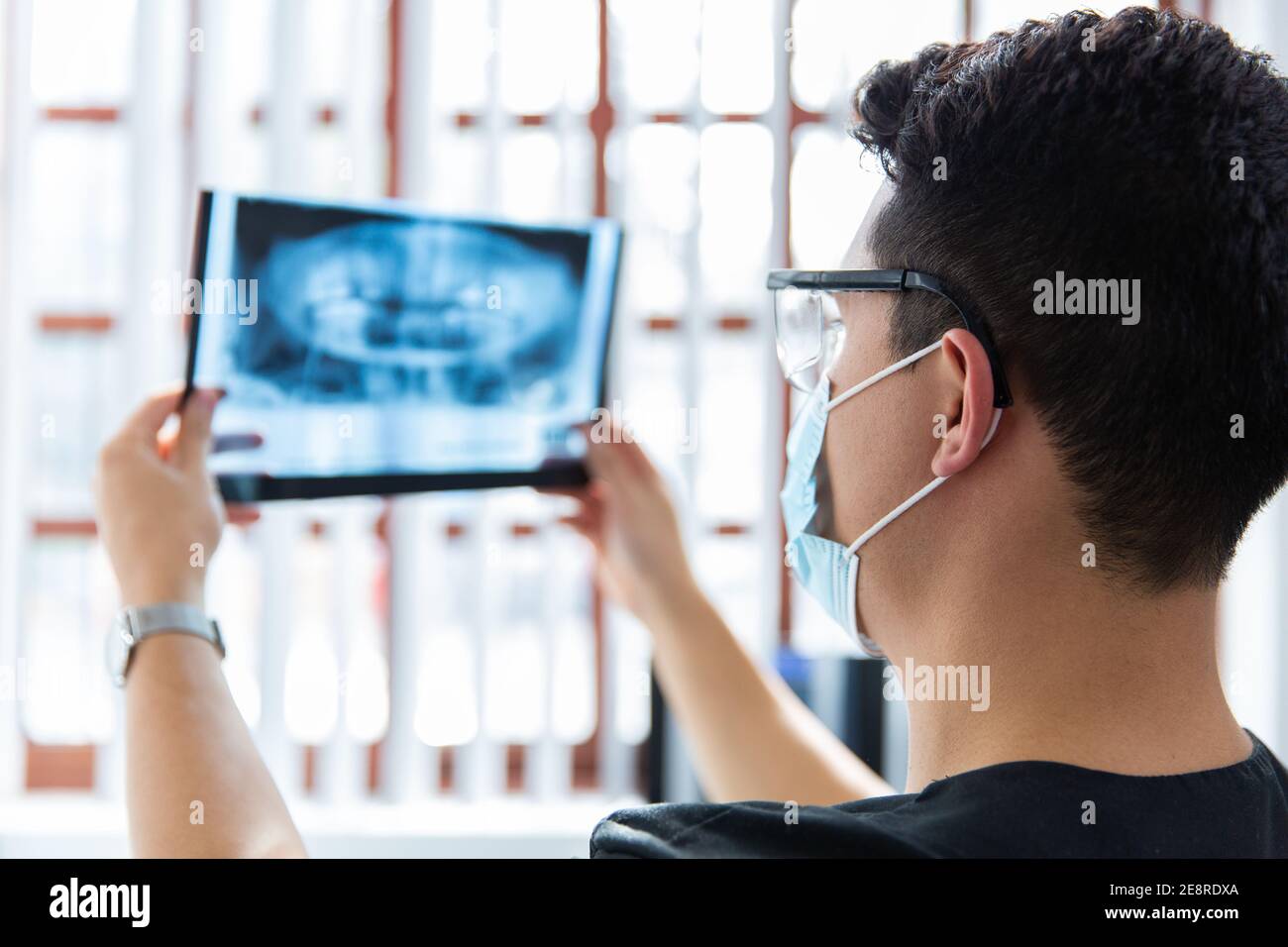 Dentist Examining a Radiography at her clinic office Stock Photo - Alamy