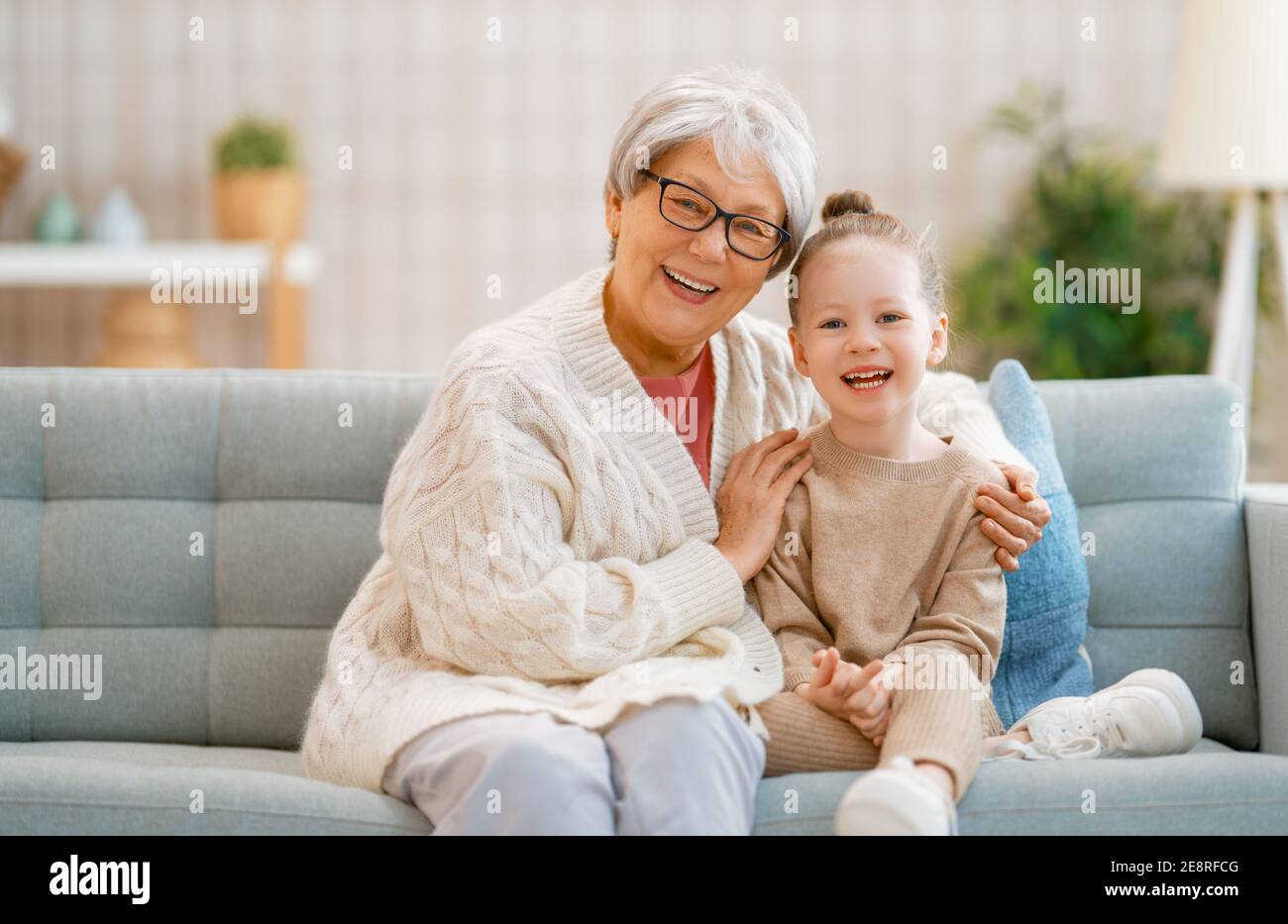 A nice girl and her grandmother enjoying sunny morning. Good time at ...