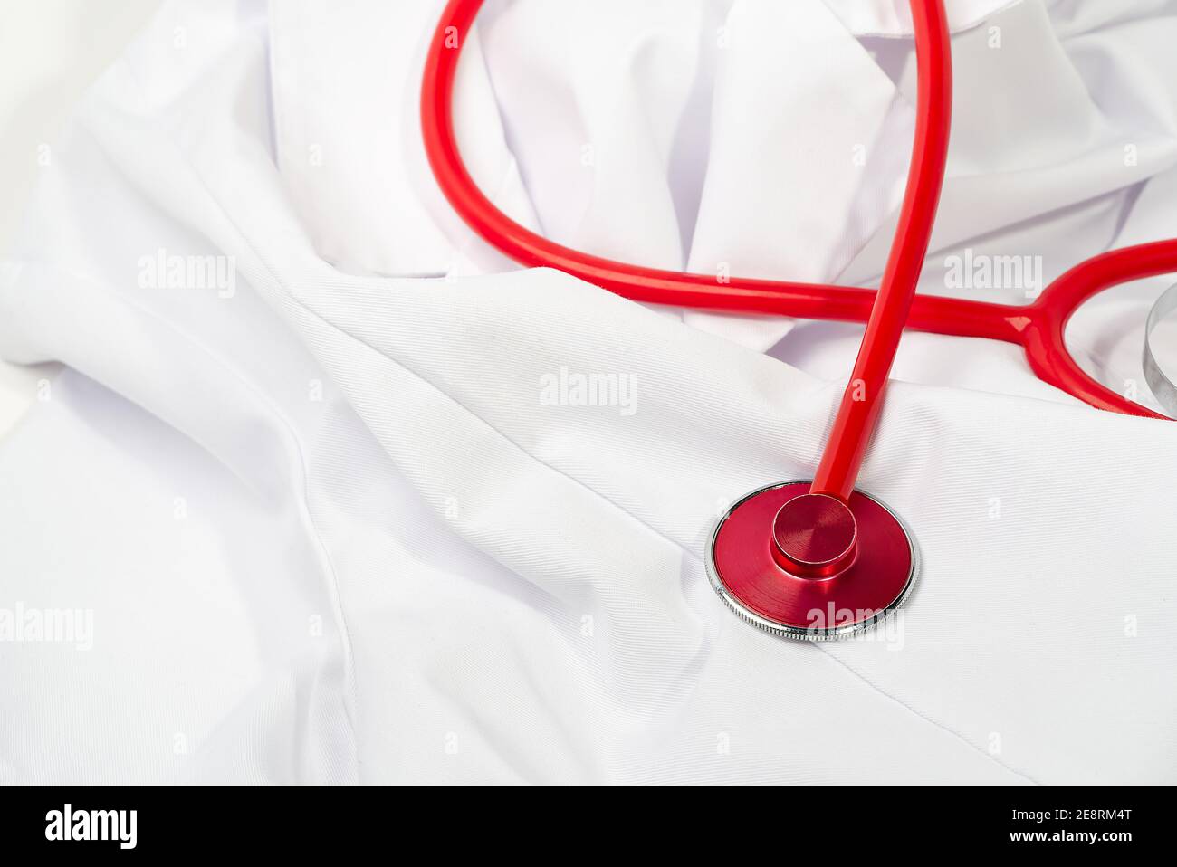Red stethoscope on white background, close up Stock Photo - Alamy