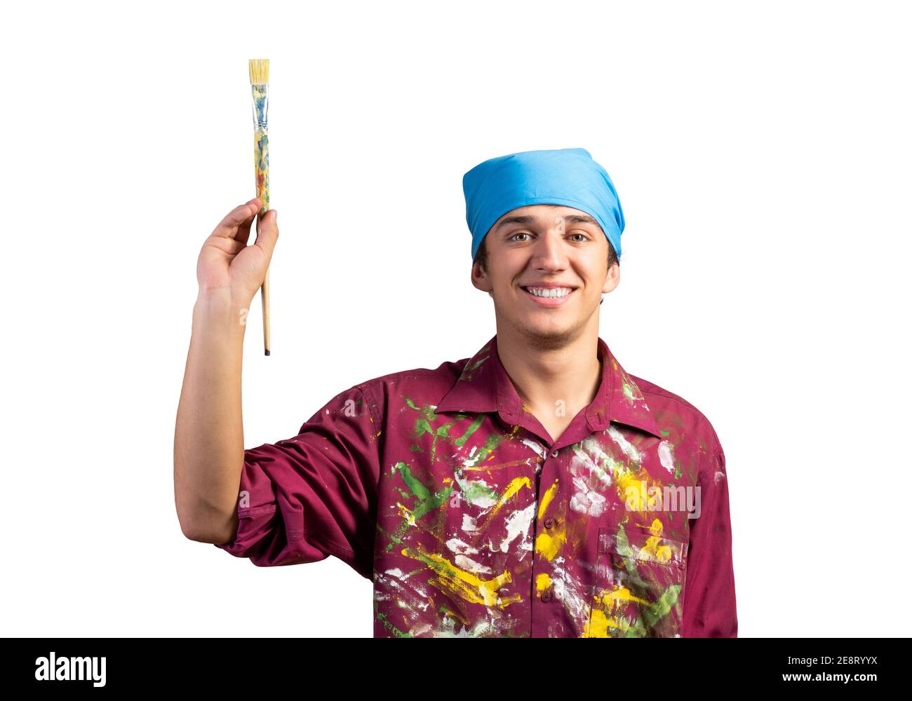 Smiling young painter artist pointing upwards Stock Photo - Alamy