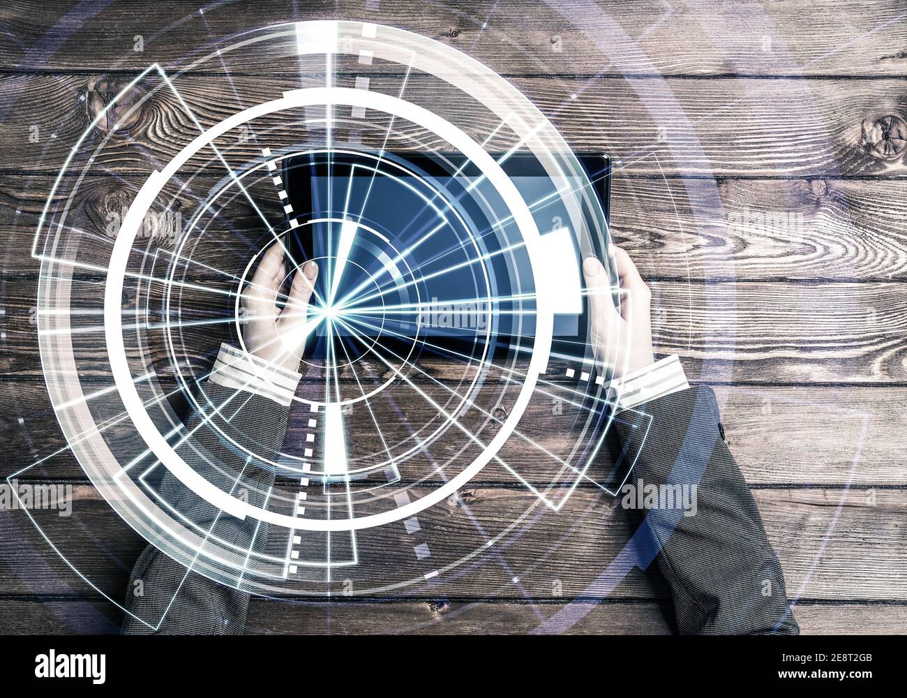 Business workplace with tablet device on wooden surface and media ...