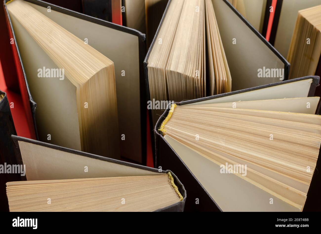 Composition with vintage old hardback books on red background. Books ...