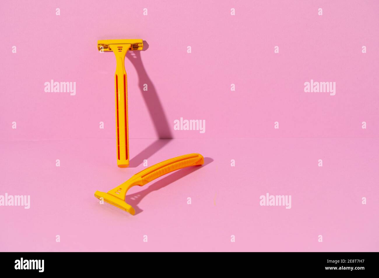 Yellow disposable razors on pink background, studio shot Stock Photo ...