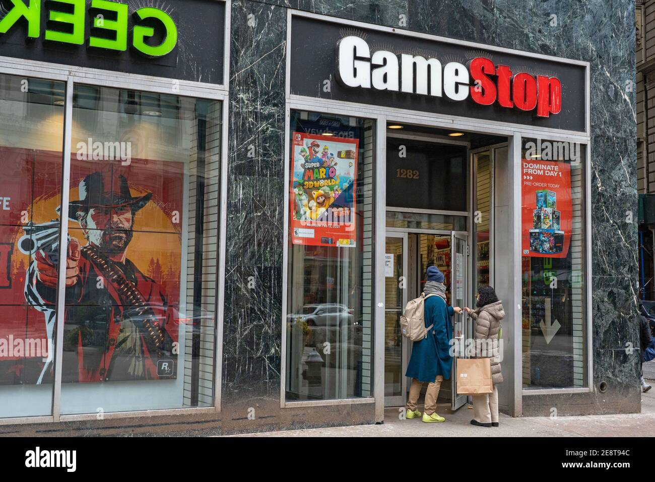 New York, United States. 31st Jan, 2021. People enter a GameStop Store ...