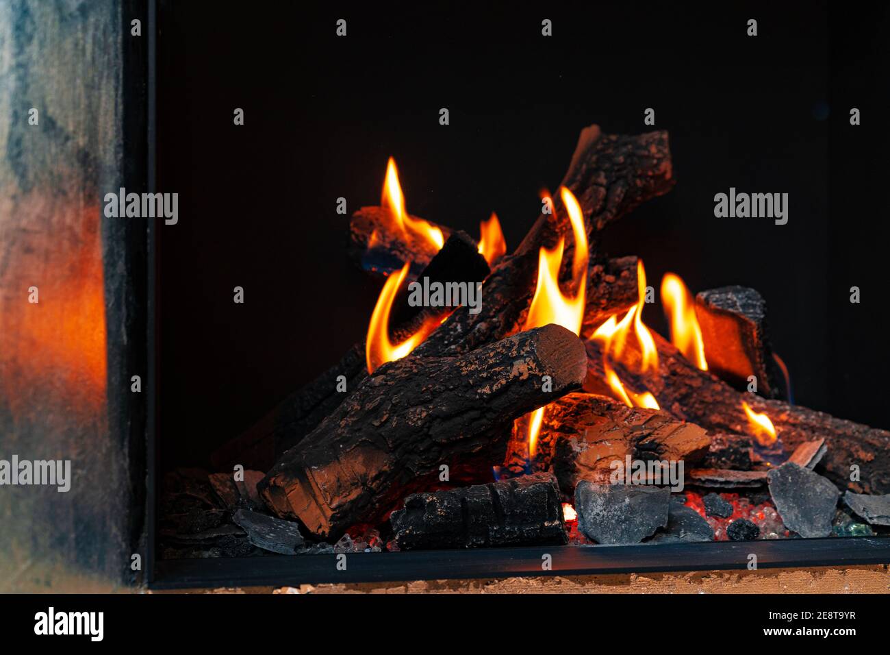 Wood logs burning in fireplace close up Stock Photo - Alamy