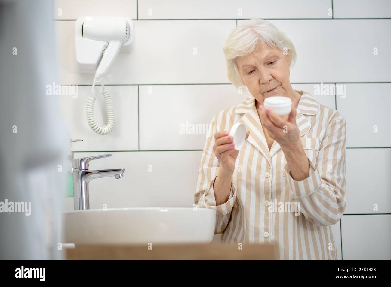 Active woman cream hands hi-res stock photography and images - Alamy