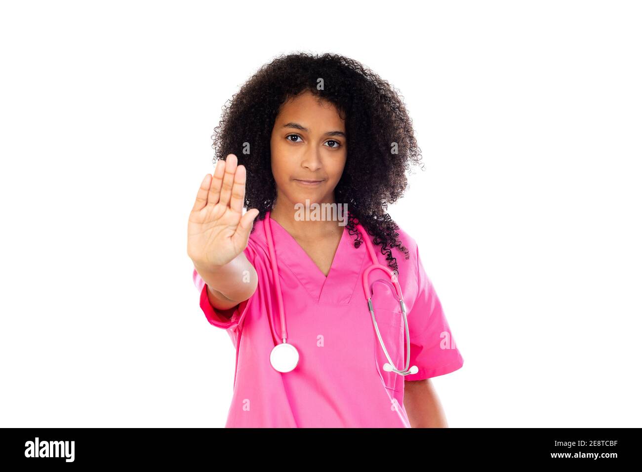 Adorable little doctor with pink uniform isolated on a white background ...