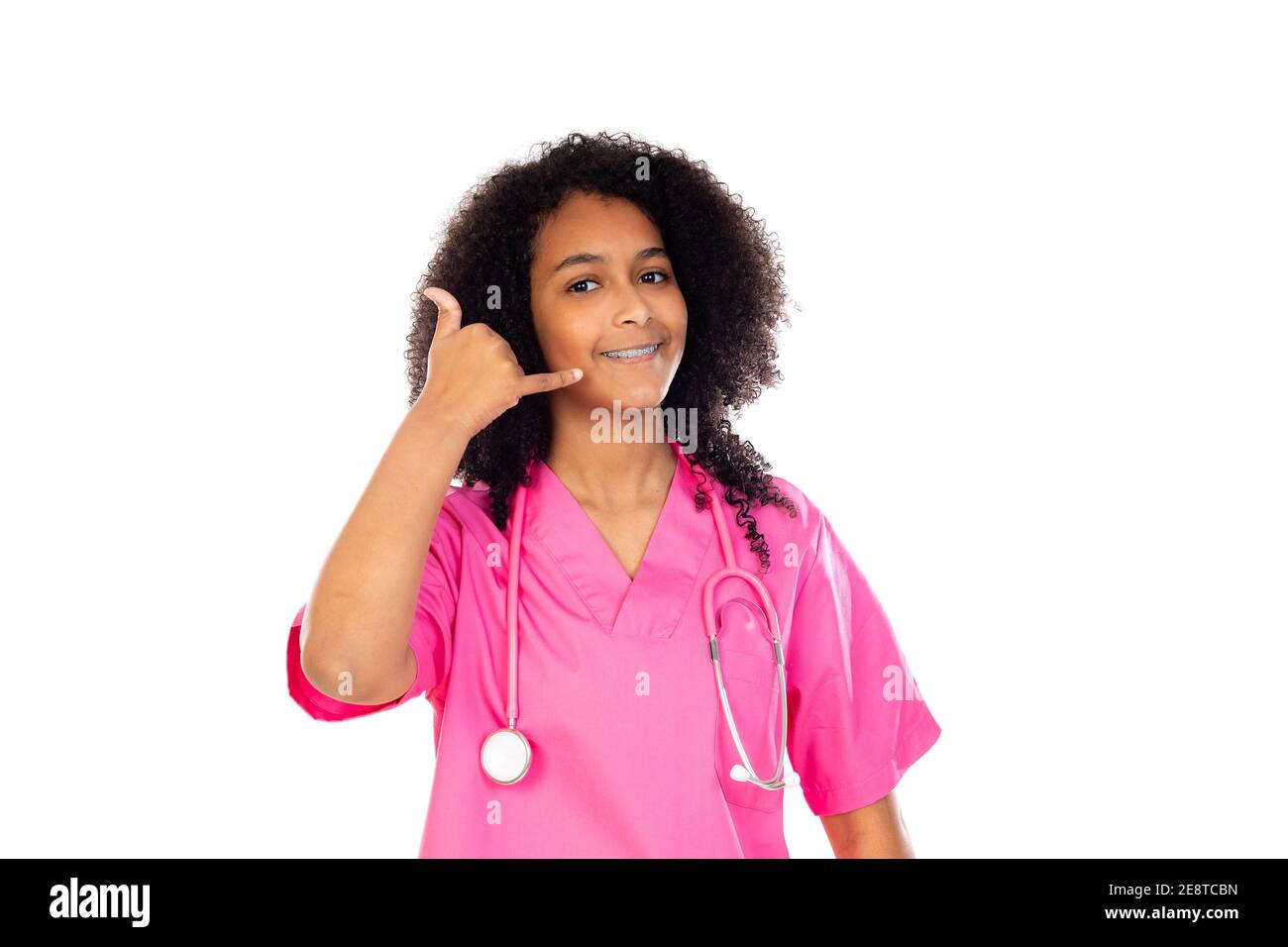 Adorable little doctor with pink uniform isolated on a white background ...