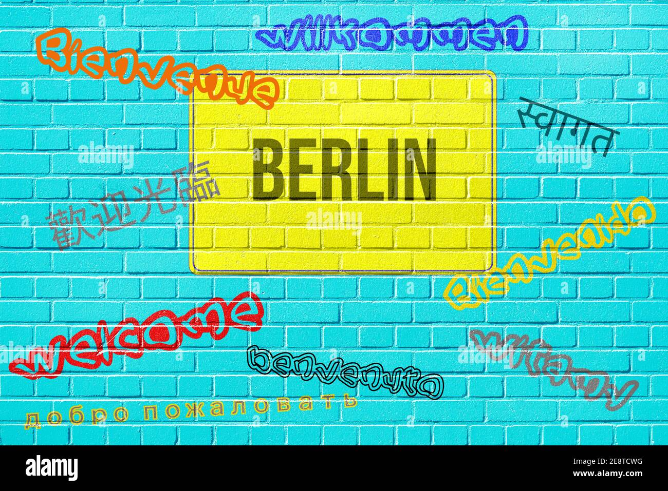 A wall with a Berlin plaque and welcome in different languages Stock ...