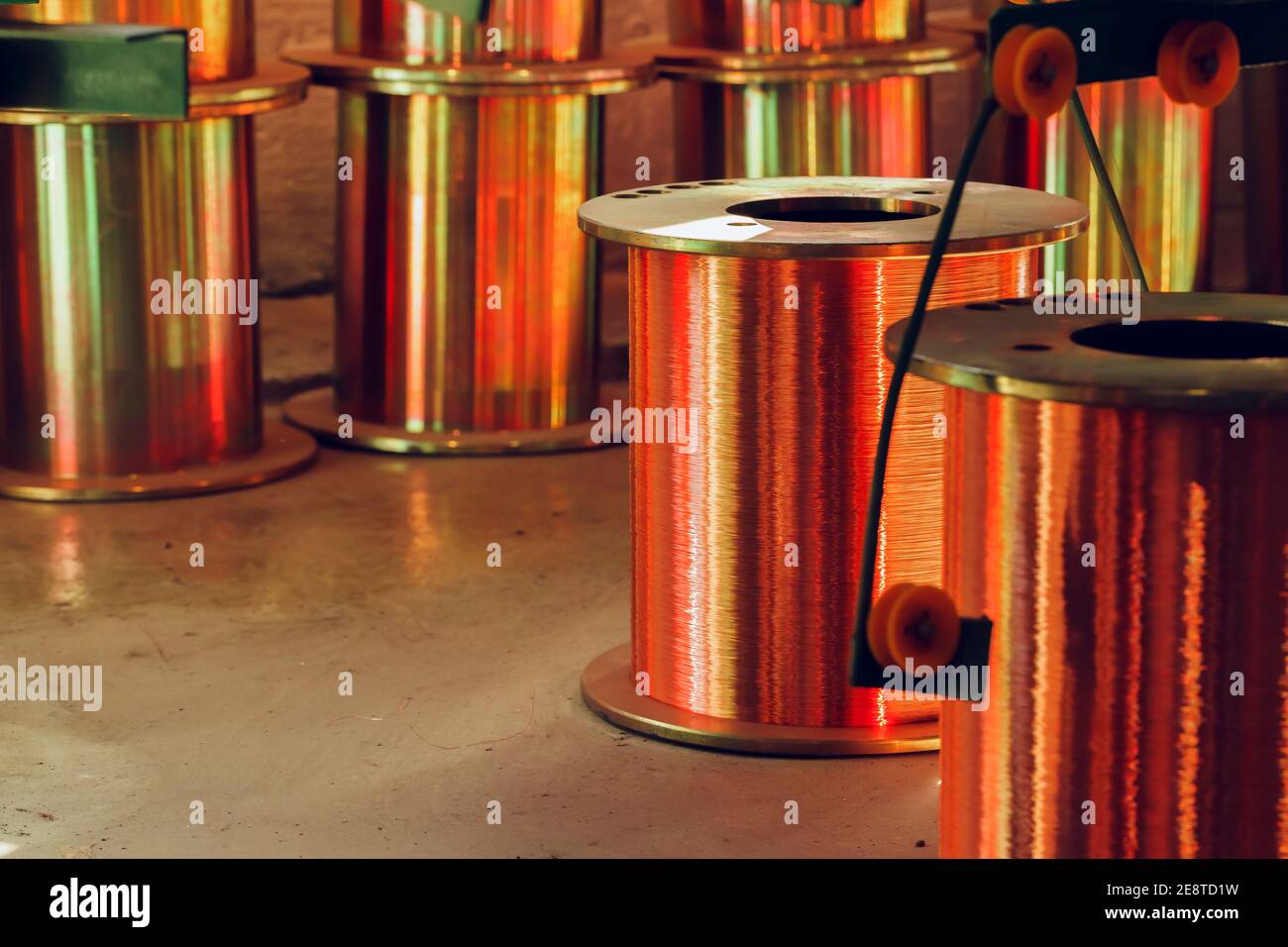 Copper wire reels in cable factory close up Stock Photo - Alamy