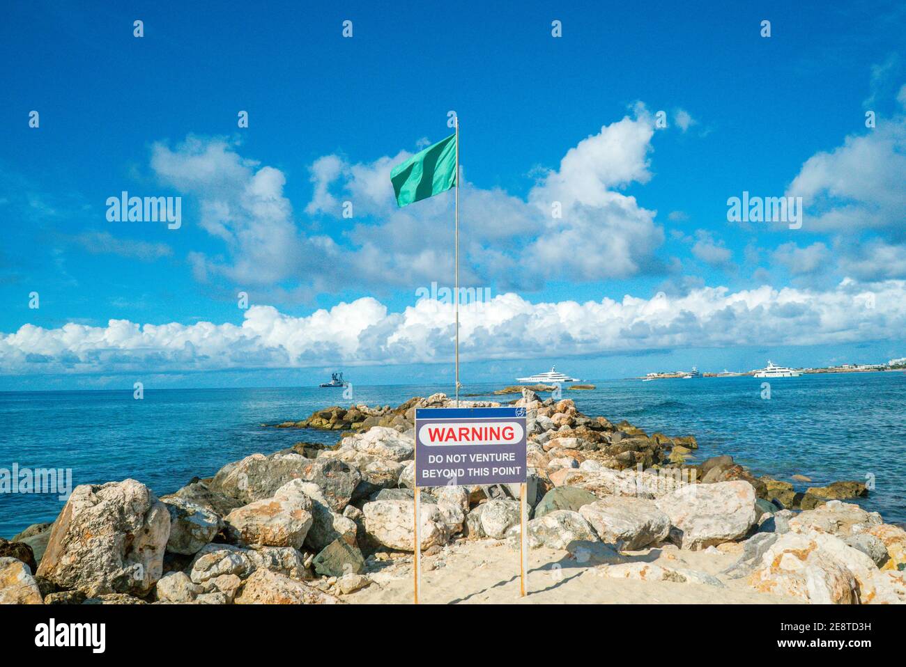 Green flag pole posted to signal the sea water conditions are safe in ...