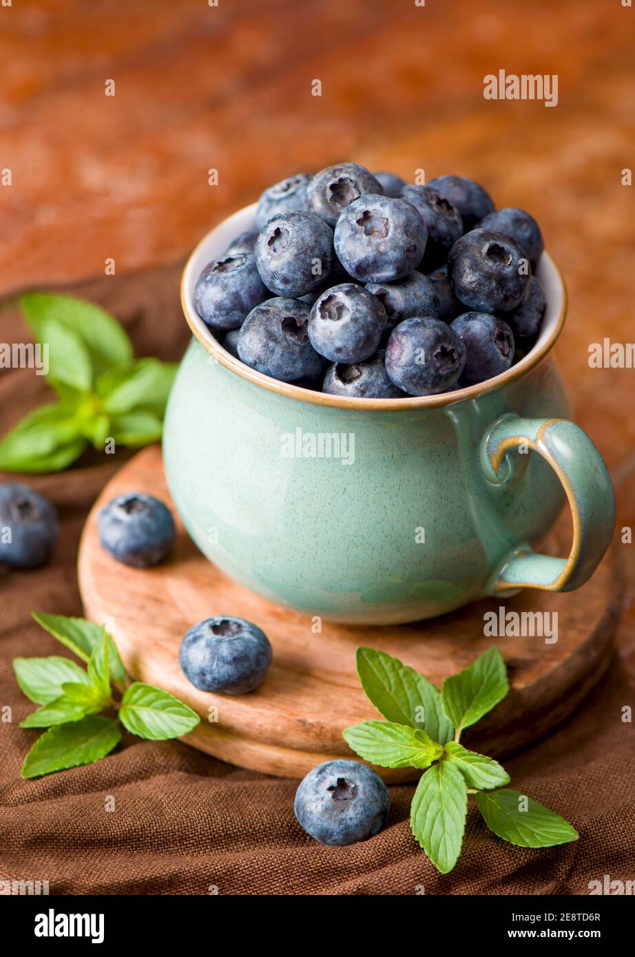 Fresh blueberry in a cup with leaves of mint Stock Photo - Alamy