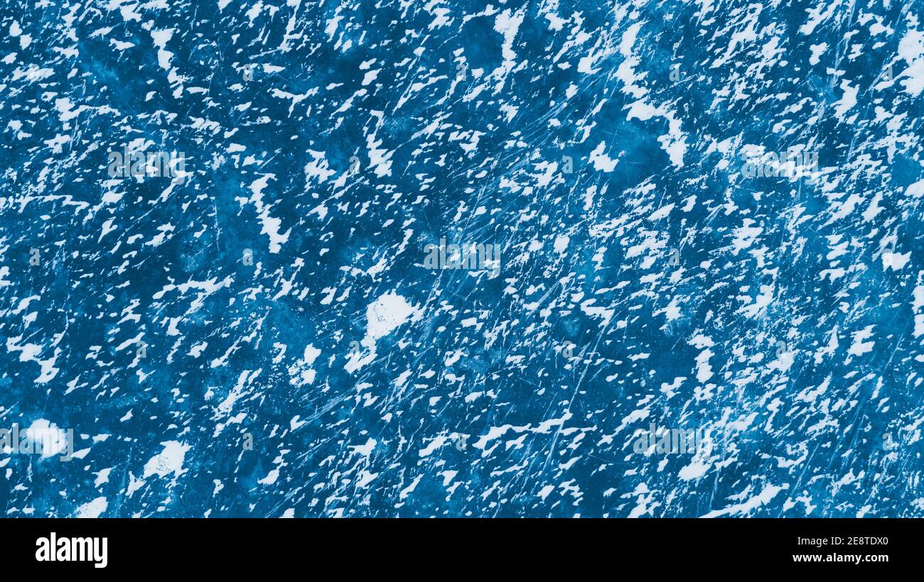 Blue ice surface with scratches and snow Stock Photo - Alamy