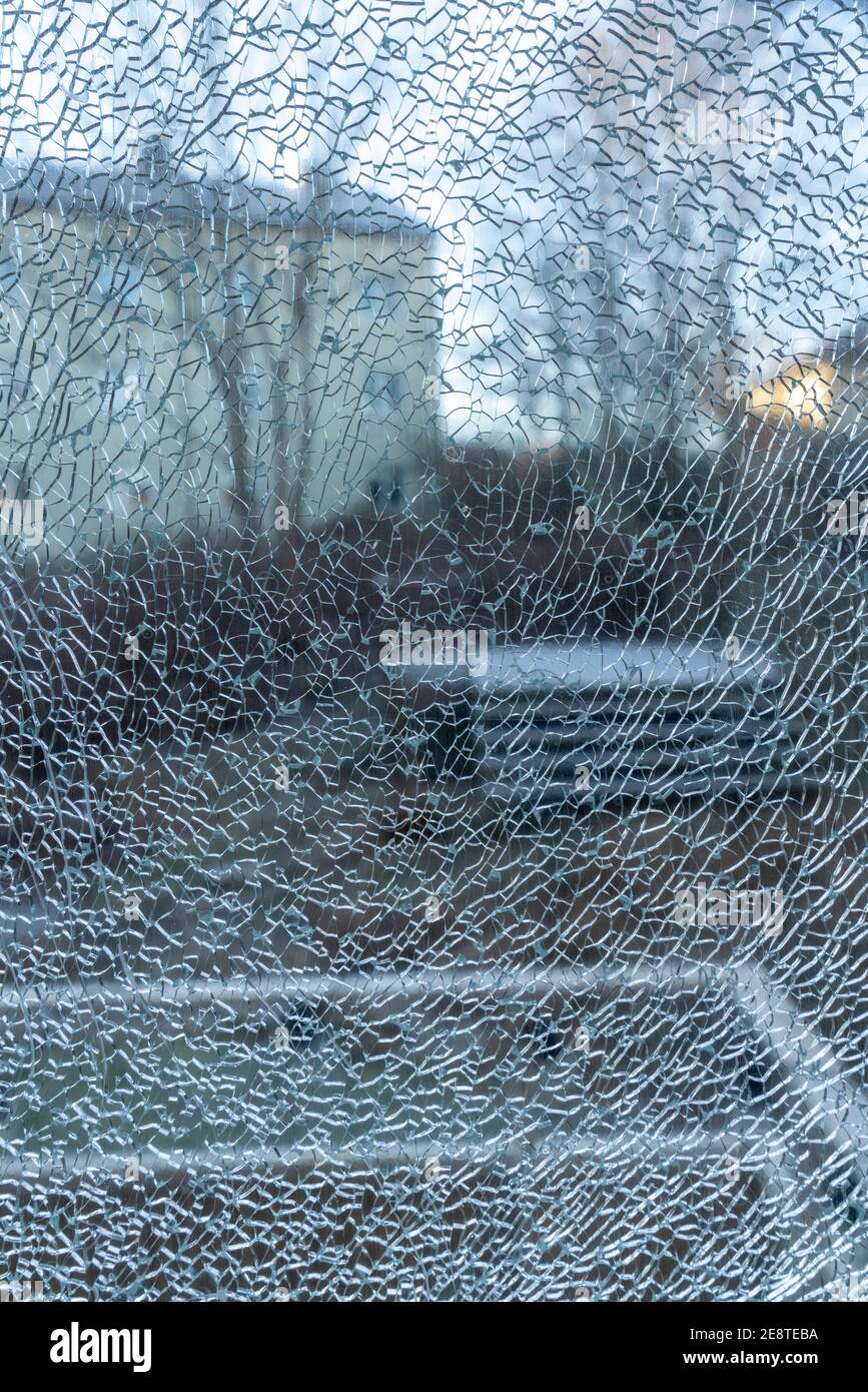 Broken balcony glass door window with shattered glass Stock Photo - Alamy