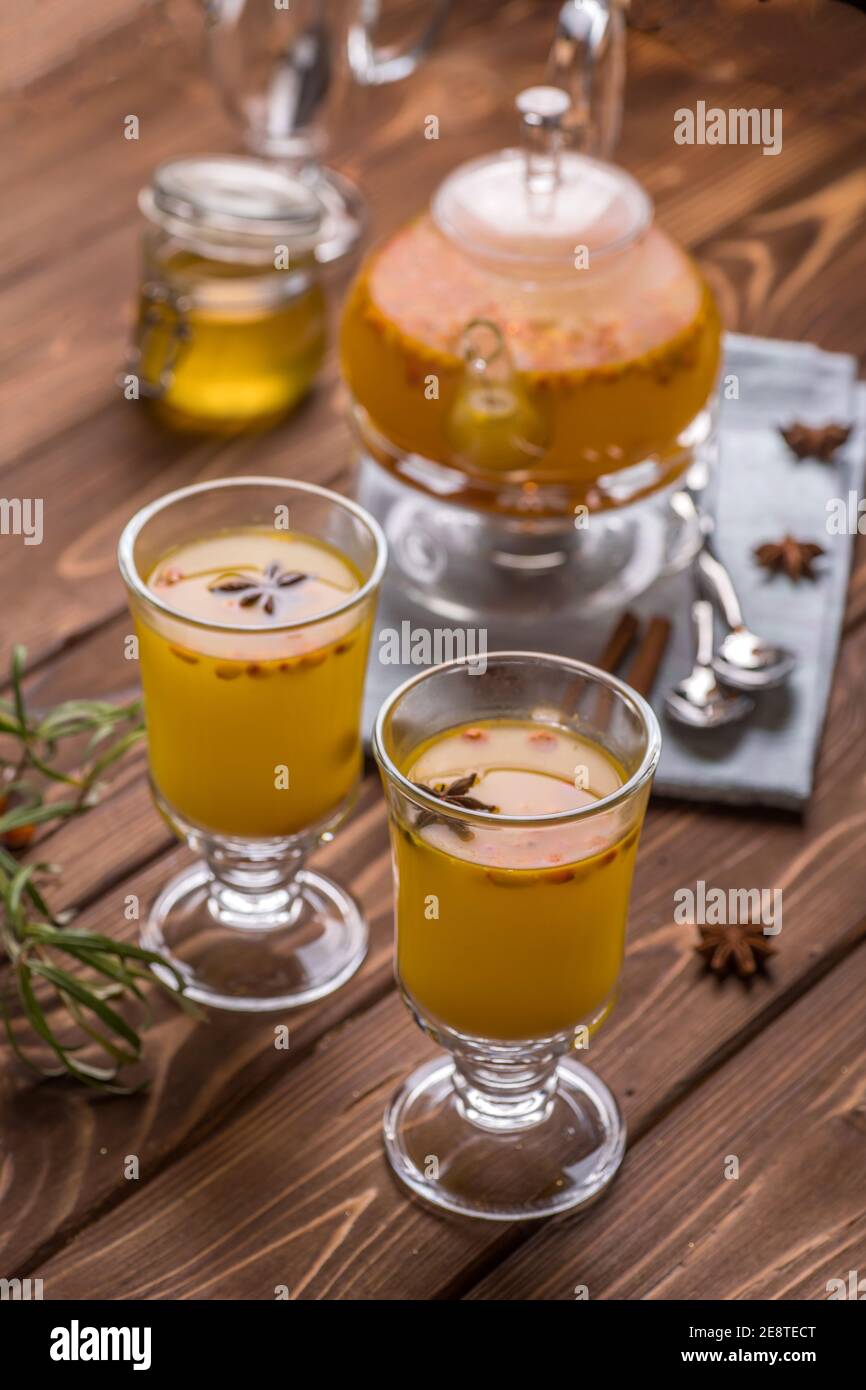 Beautiful glass teapot with sea buckthorn tea. Hot winter drinks Stock ...