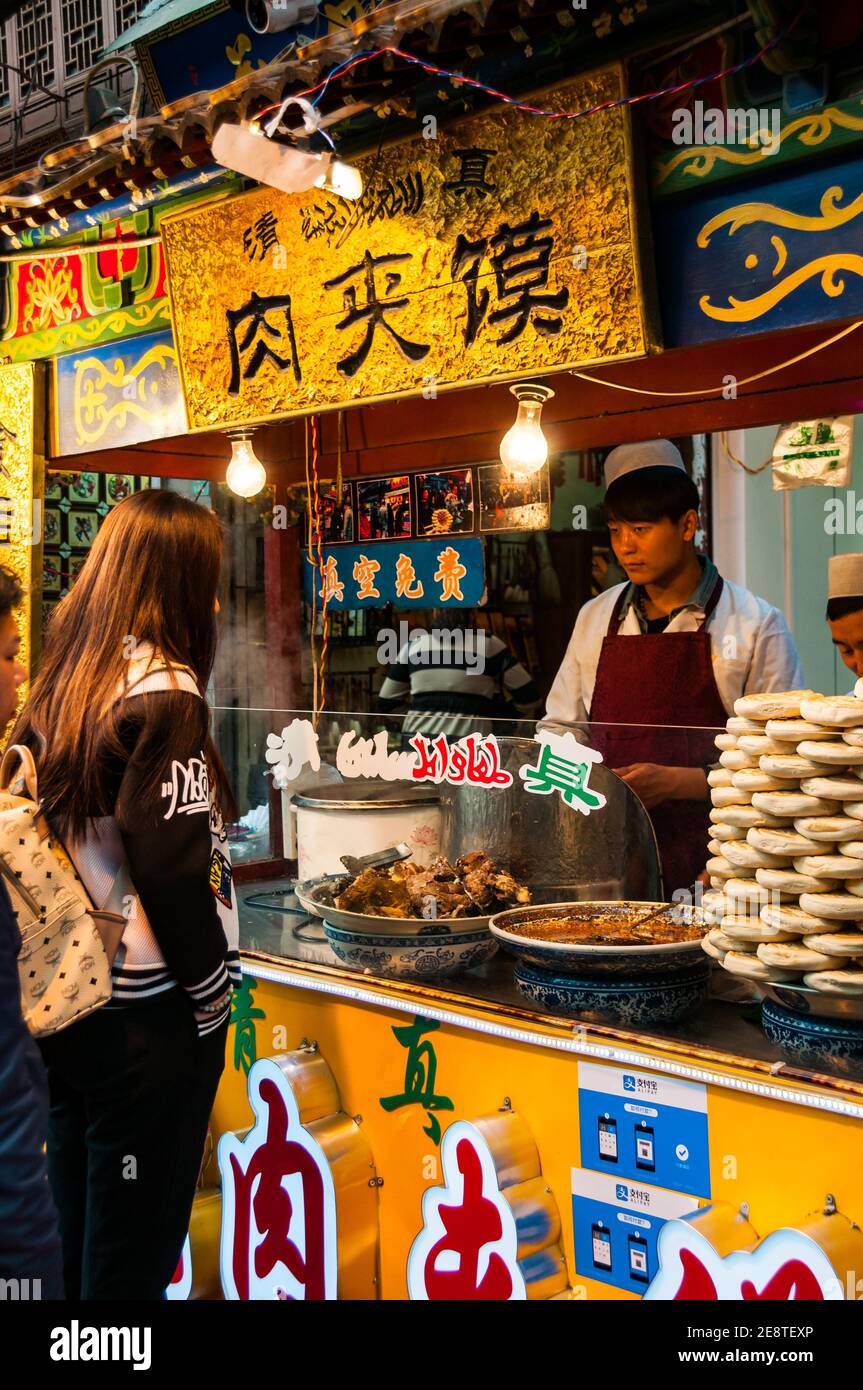 A halal food stall selling roujiamo, a kind of Chinese hamburger, on ...
