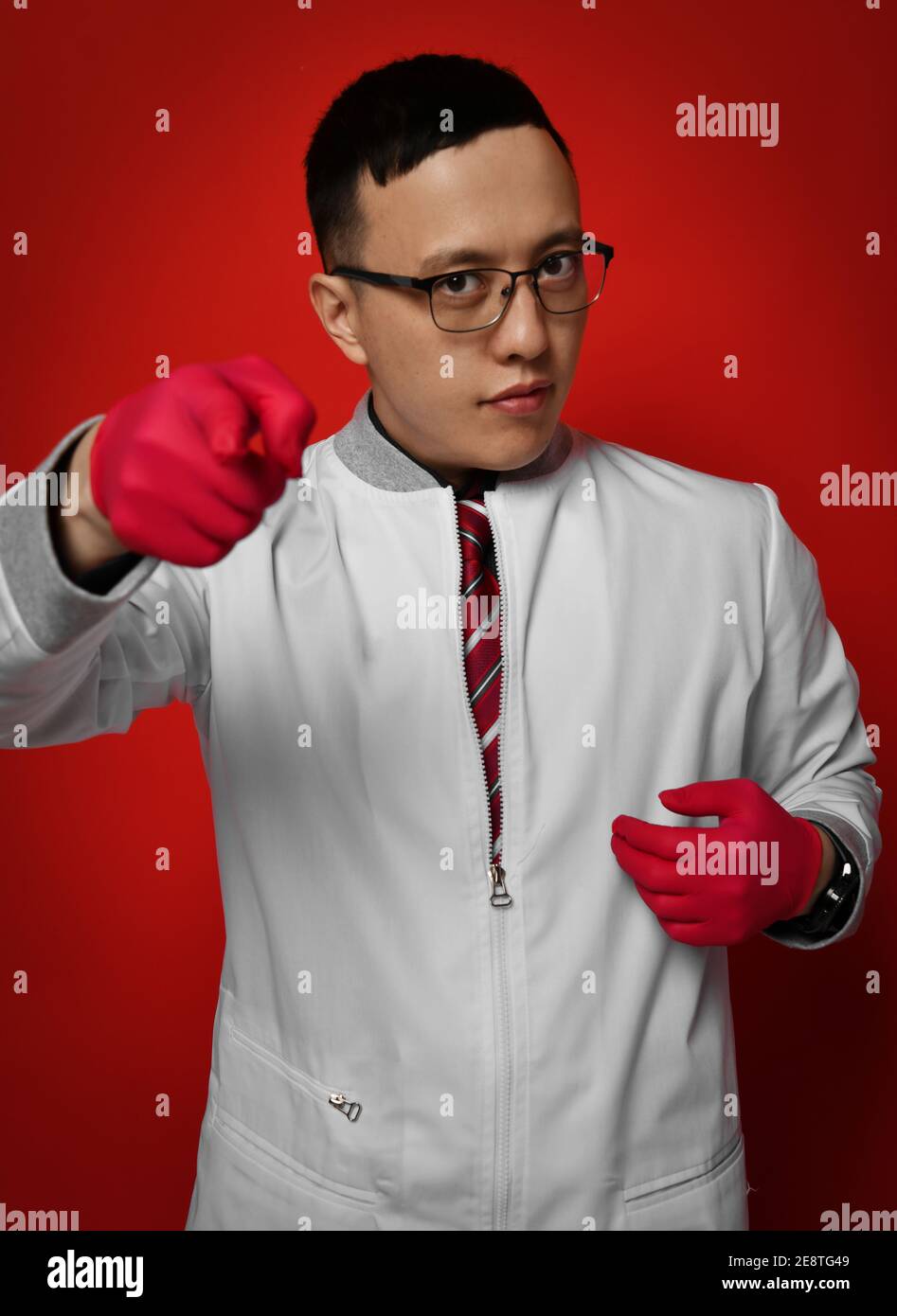 Portrait of young man doctor urologist or proctologist in medical gown ...