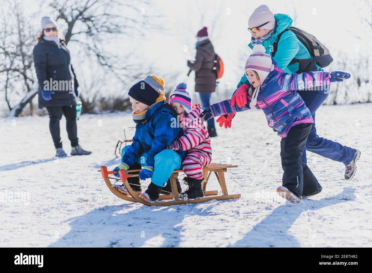 Boy pushing sled hi-res stock photography and images - Alamy