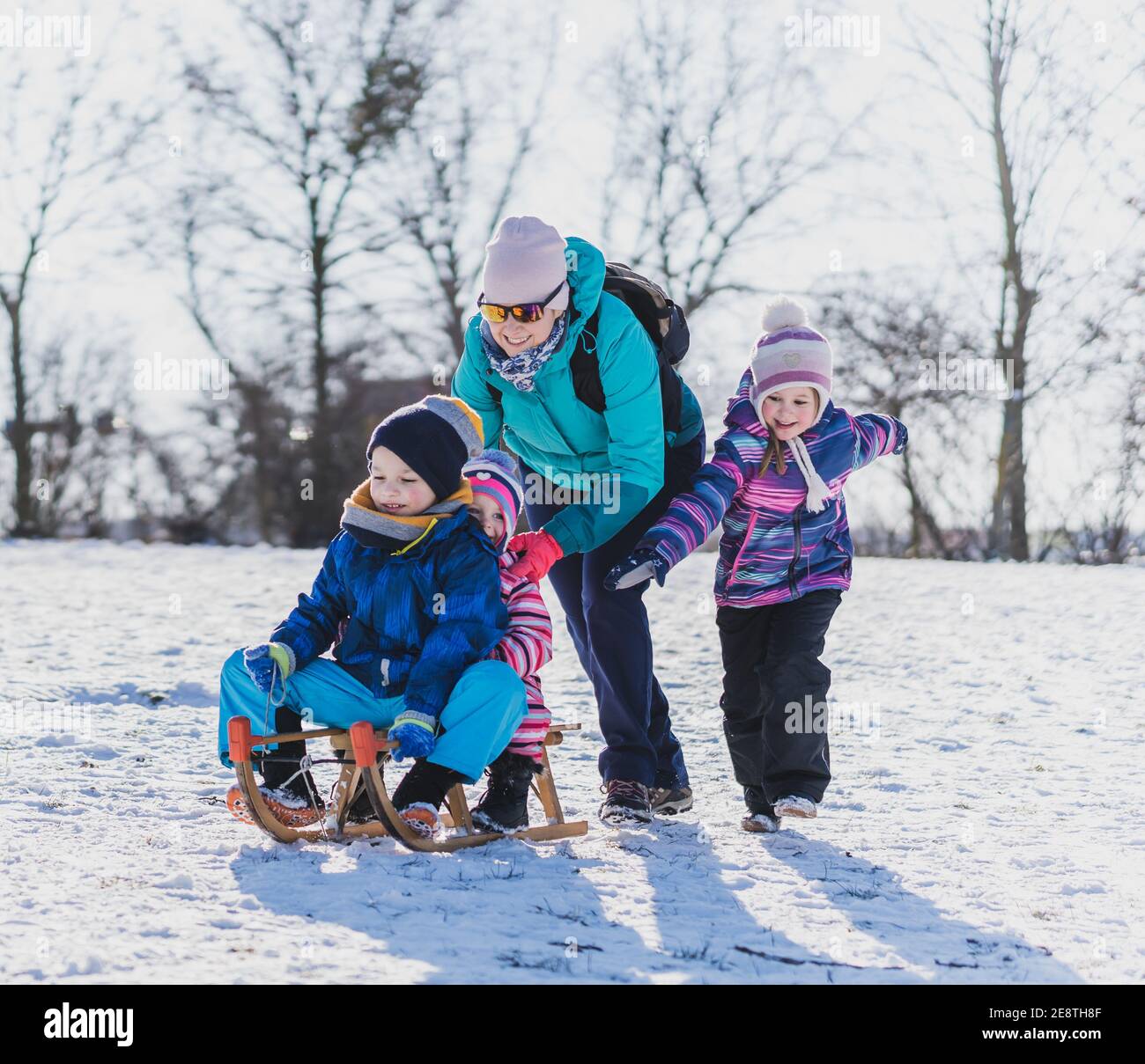 Boy pushing sled hi-res stock photography and images - Alamy