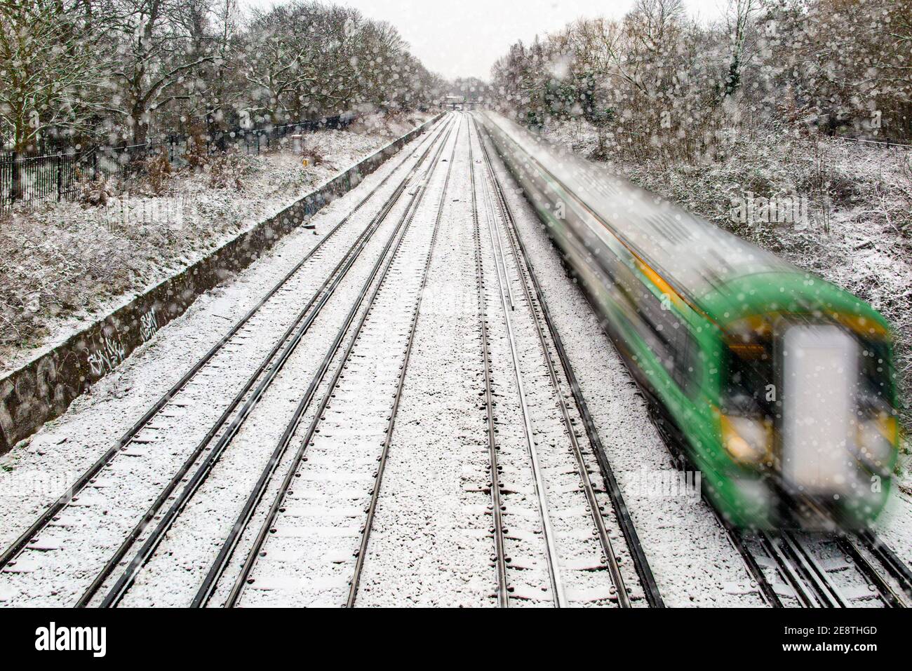 A Southern train heads south in heavy snow Stock Photo - Alamy