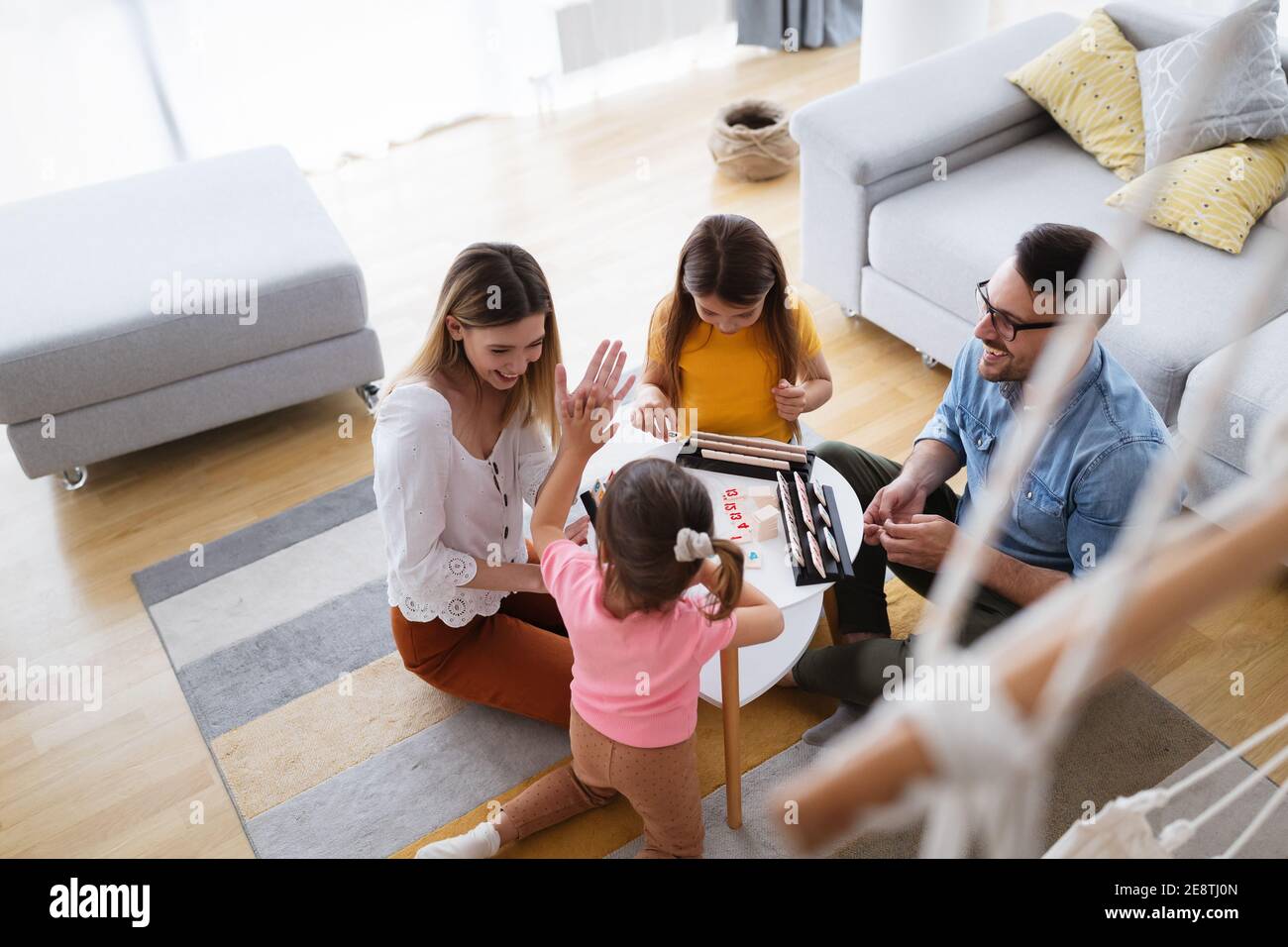 Happy family having fun times at home hi-res stock photography and ...