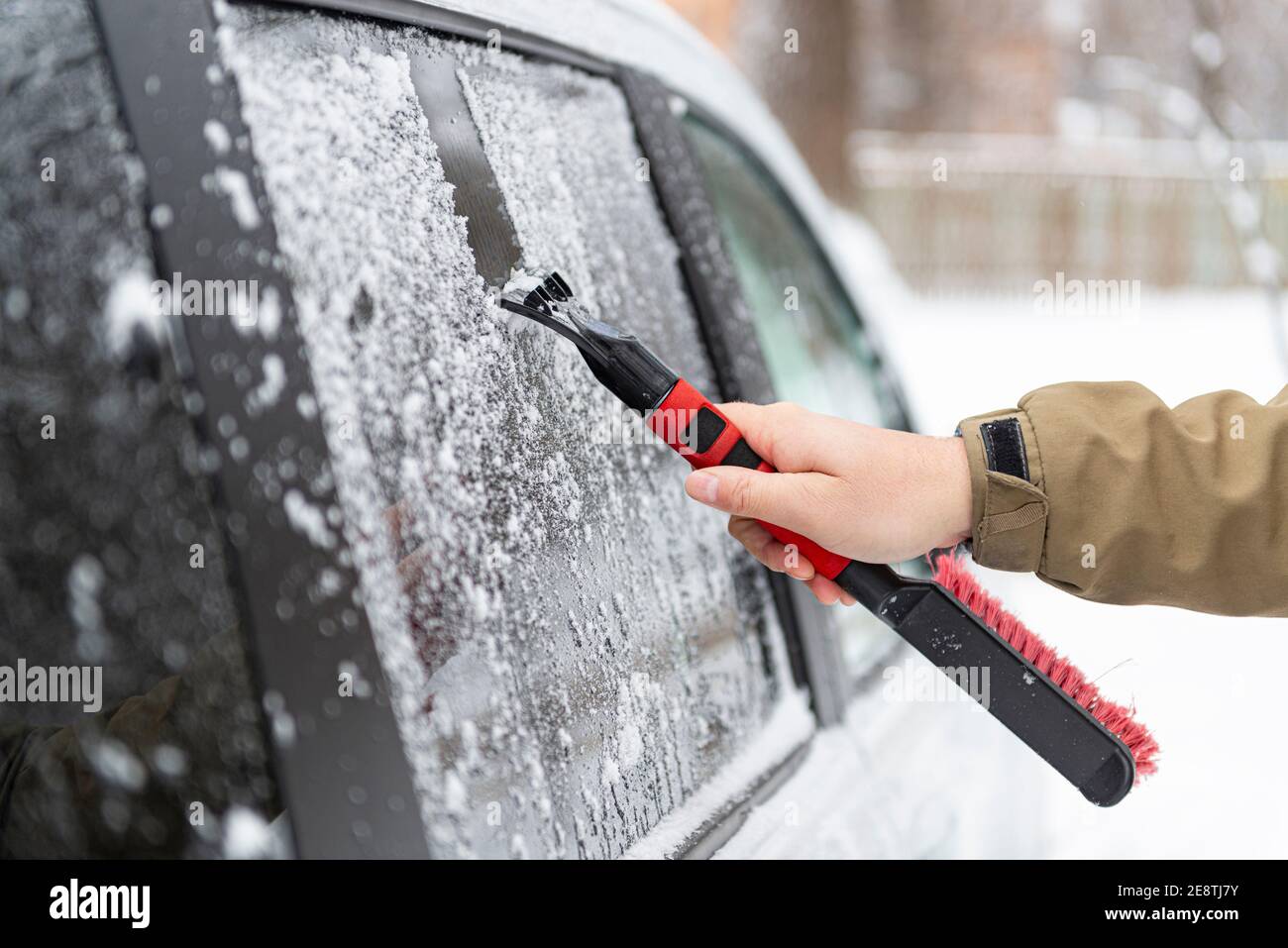 Snow and ice from the car windscreen hi-res stock photography and ...