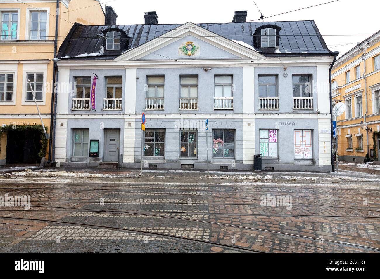 Finland, Helsinki. January 26, 2021 The facade of a gray building. The ...