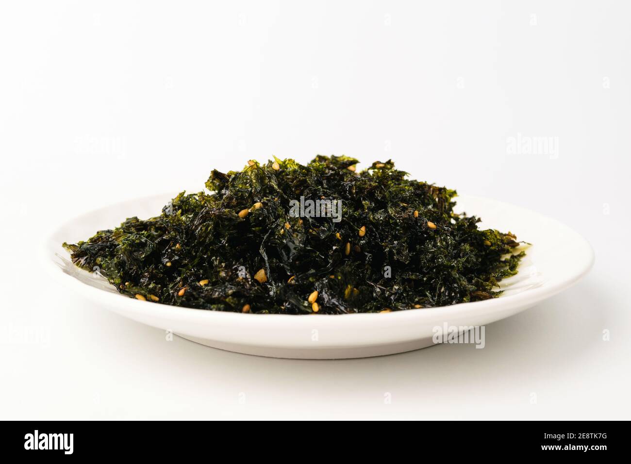 Seasoned seaweed on white background Stock Photo - Alamy