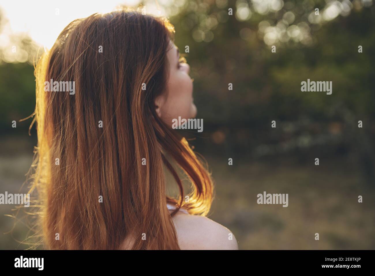 attractive woman outdoors in the garden sunset fresh air trees Stock Photo - Alamy