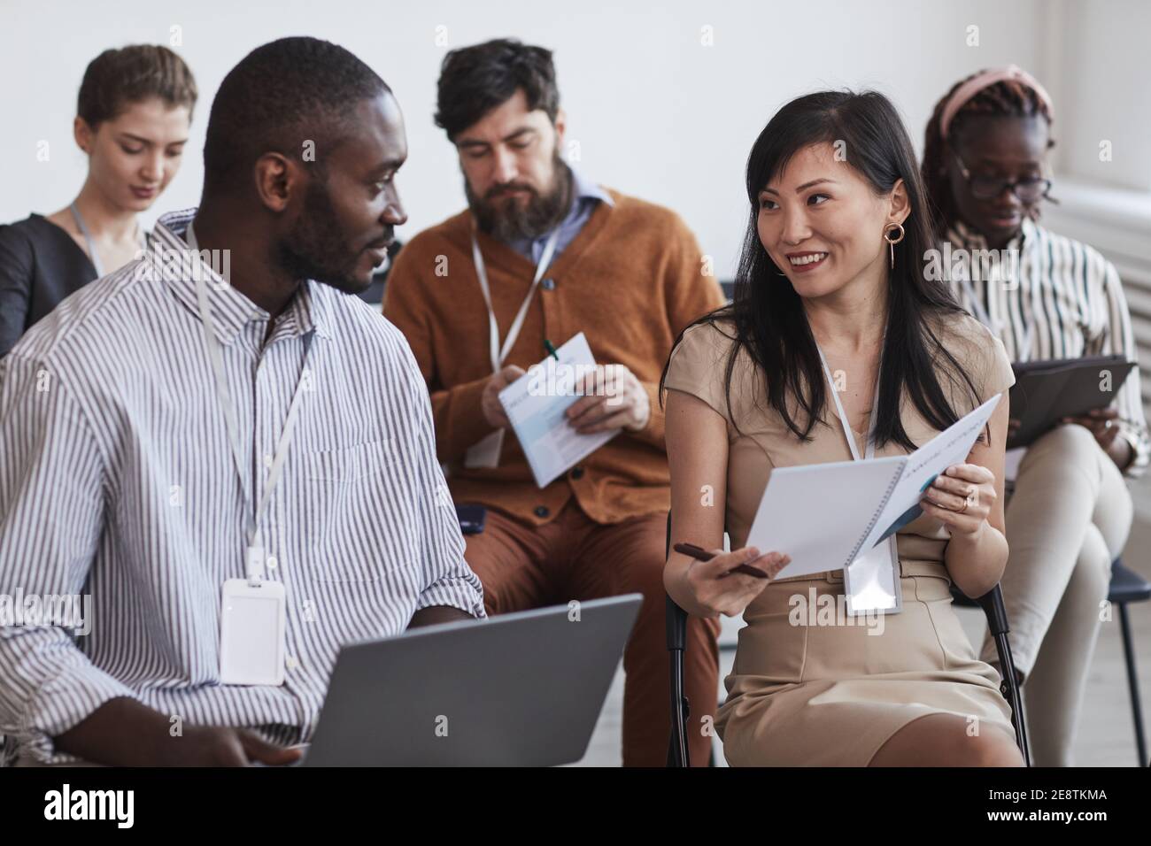 Row Of People Sitting On Chairs High Resolution Stock Photography and ...