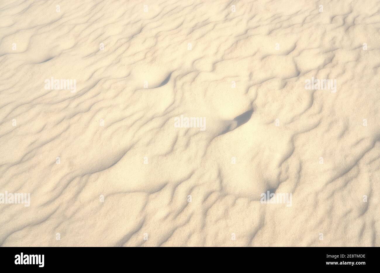 Light beach sand as a travel background with texture Stock Photo - Alamy