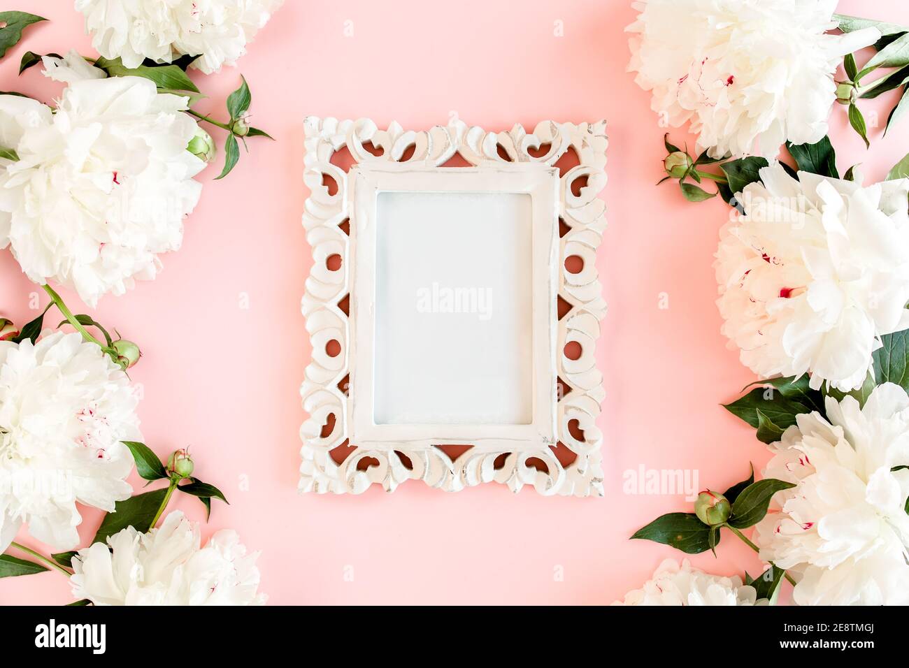 Carved, white frame decorated of white peony flowers on pink background ...