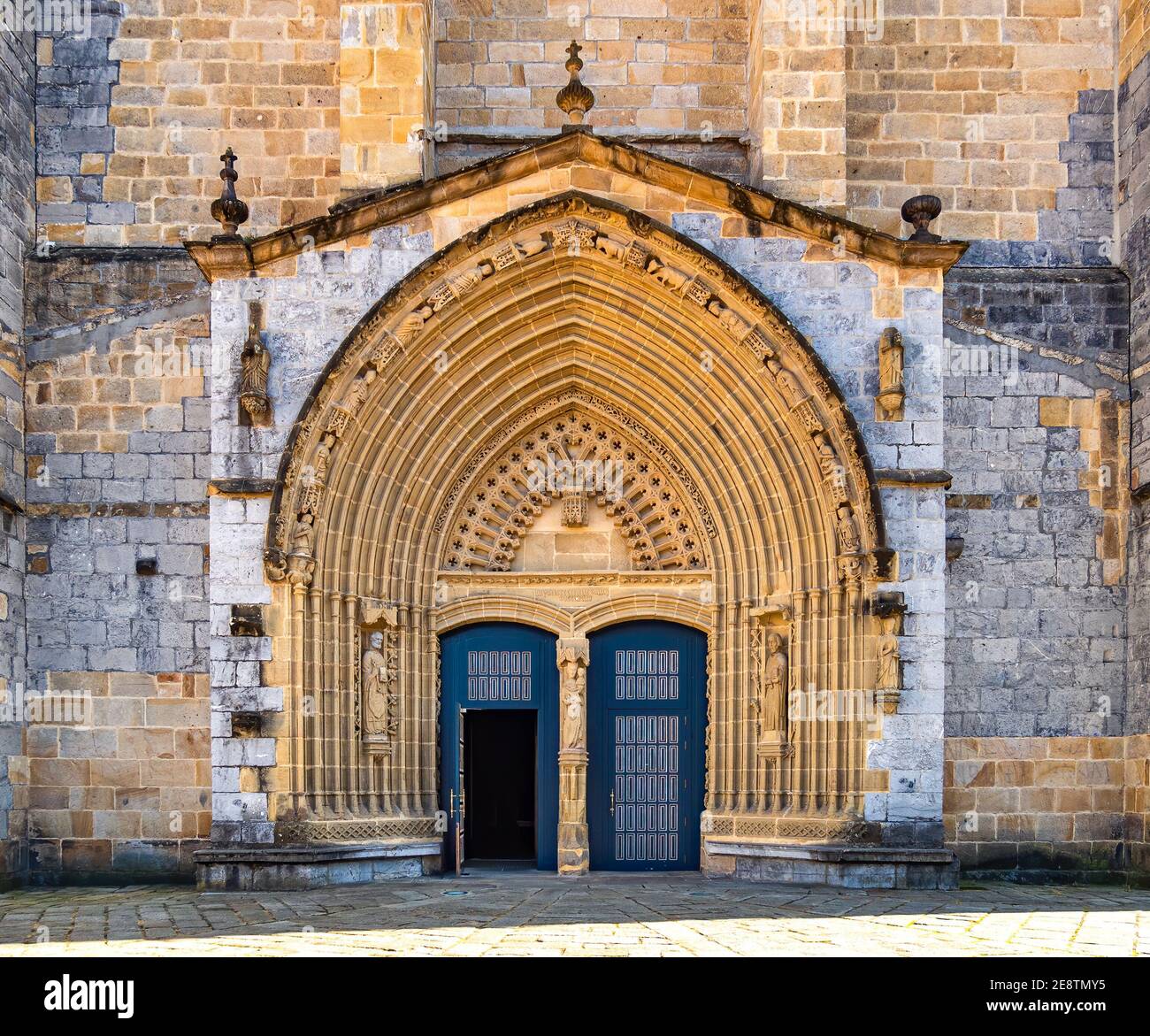 Entrance door and main facade of old stone church of Andra Maria in ...