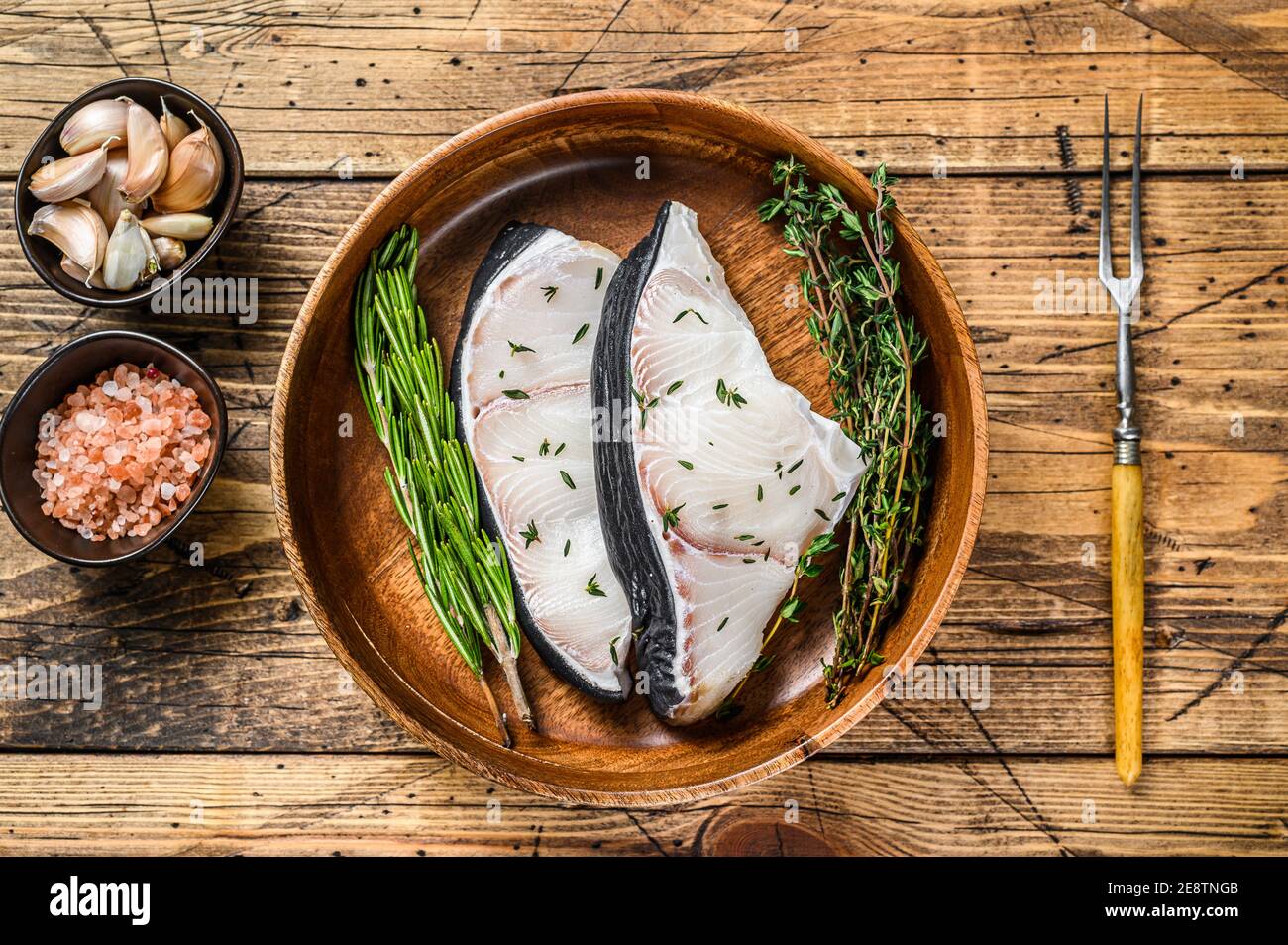 Raw Blue Shark steaks in a wooden plate. wooden background. Top view ...