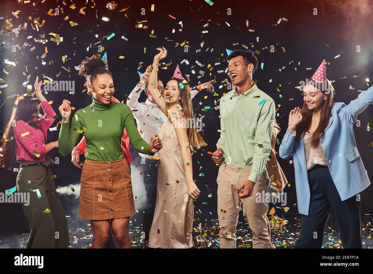 Celebration and party. Group of young happy multiracial people wearing ...