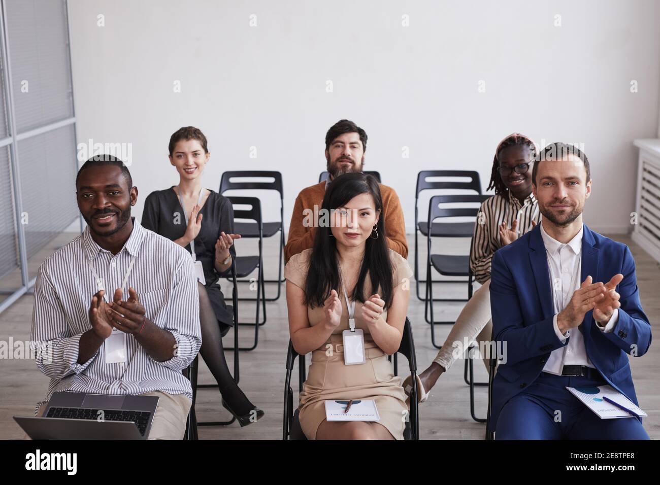 Group of people looking at camera hi-res stock photography and images ...