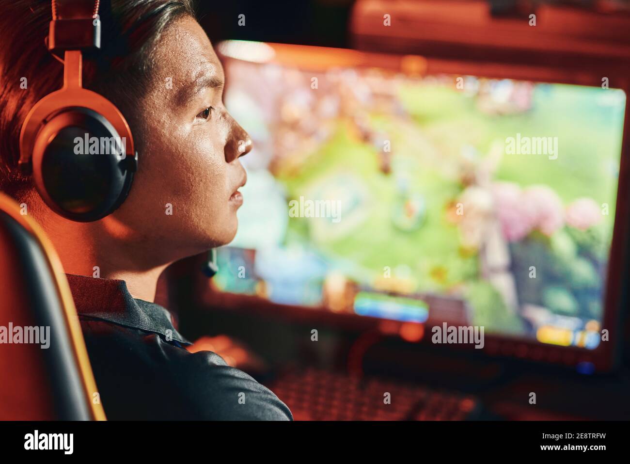 Close up shot of a focused asian guy, professional cybersport gamer ...
