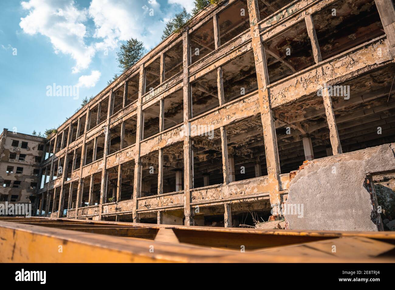 View of an old rusty industrial abandoned building Stock Photo - Alamy
